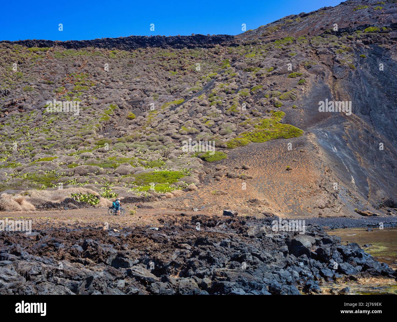 View of the scenic lava rock cliff on the Linosa island. Sicily Stock ...