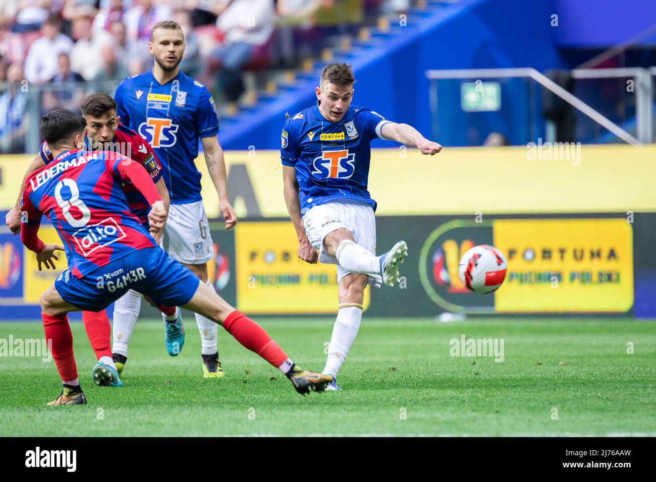 Ben Lederman of Rakow and Jakub Kaminski of Lech in action during ...