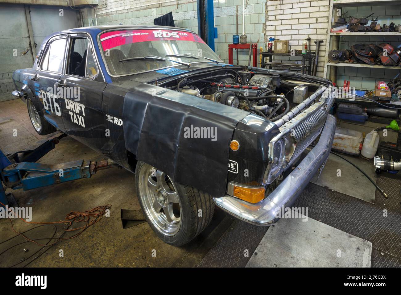 SAINT PETERSBURG, RUSSIA - APRIL 08, 2022: Black custom Volga GAZ-24 in ...