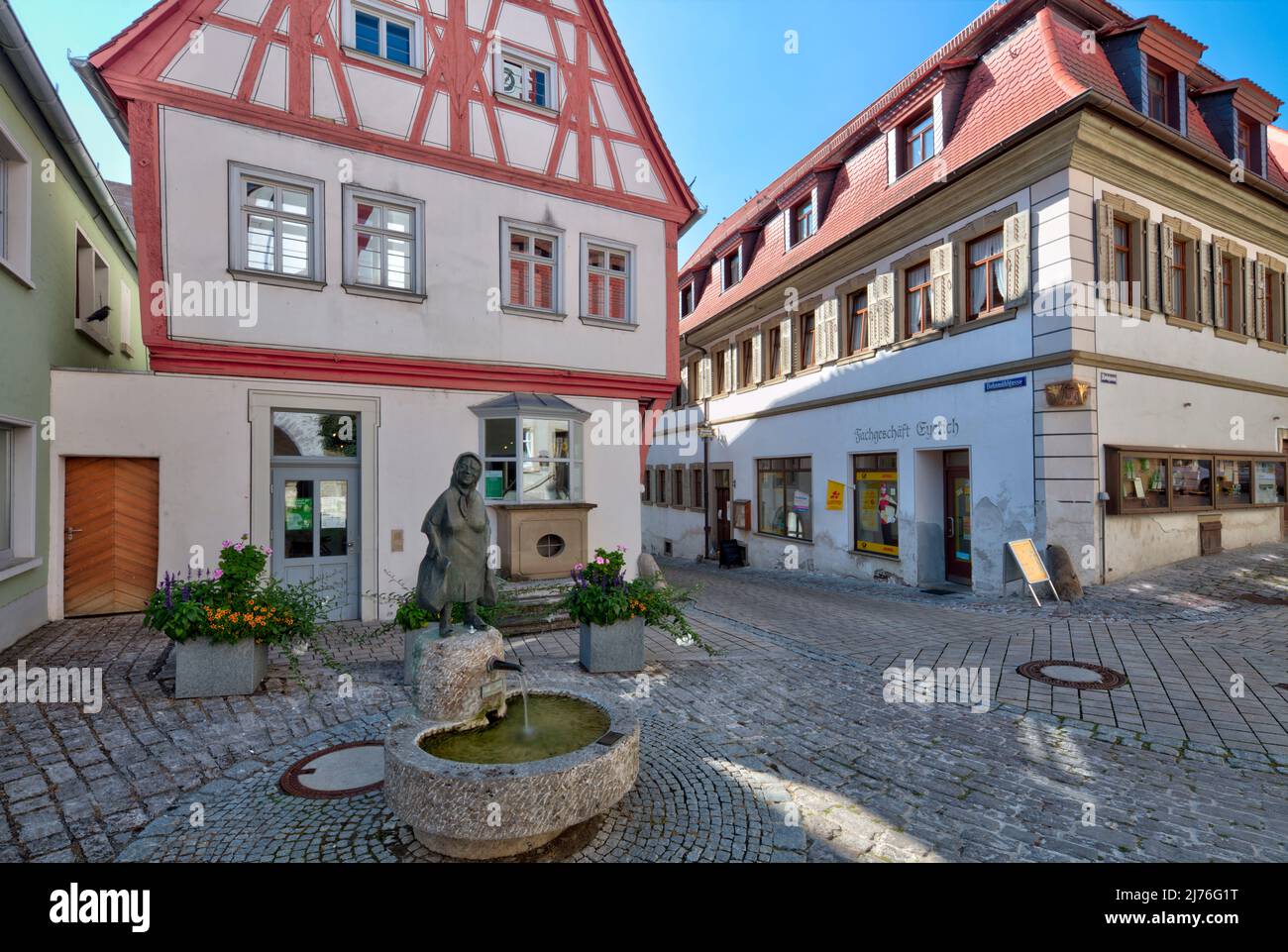 Fountain at the market, house facade, half-timbering, village view ...