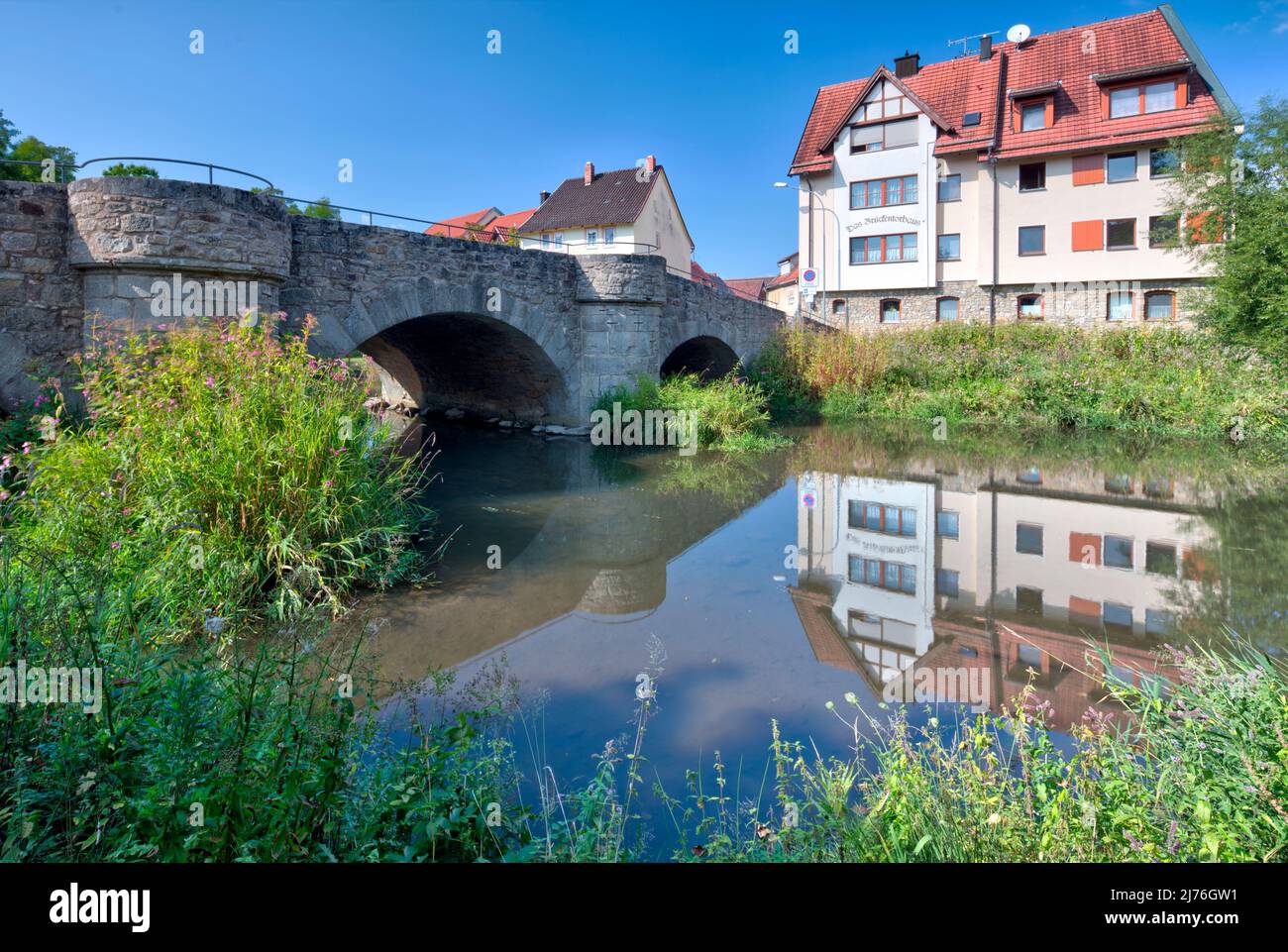 River Streu, stone bridge, The Bridge Gate House, house facade, autumn ...