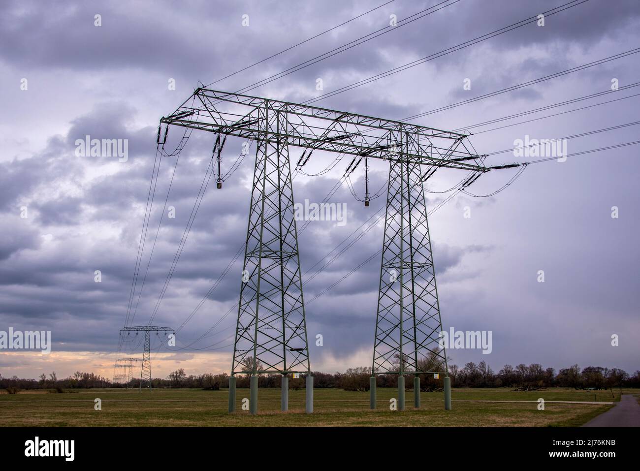 Electricity transmission pylon standing on hi-res stock photography and ...
