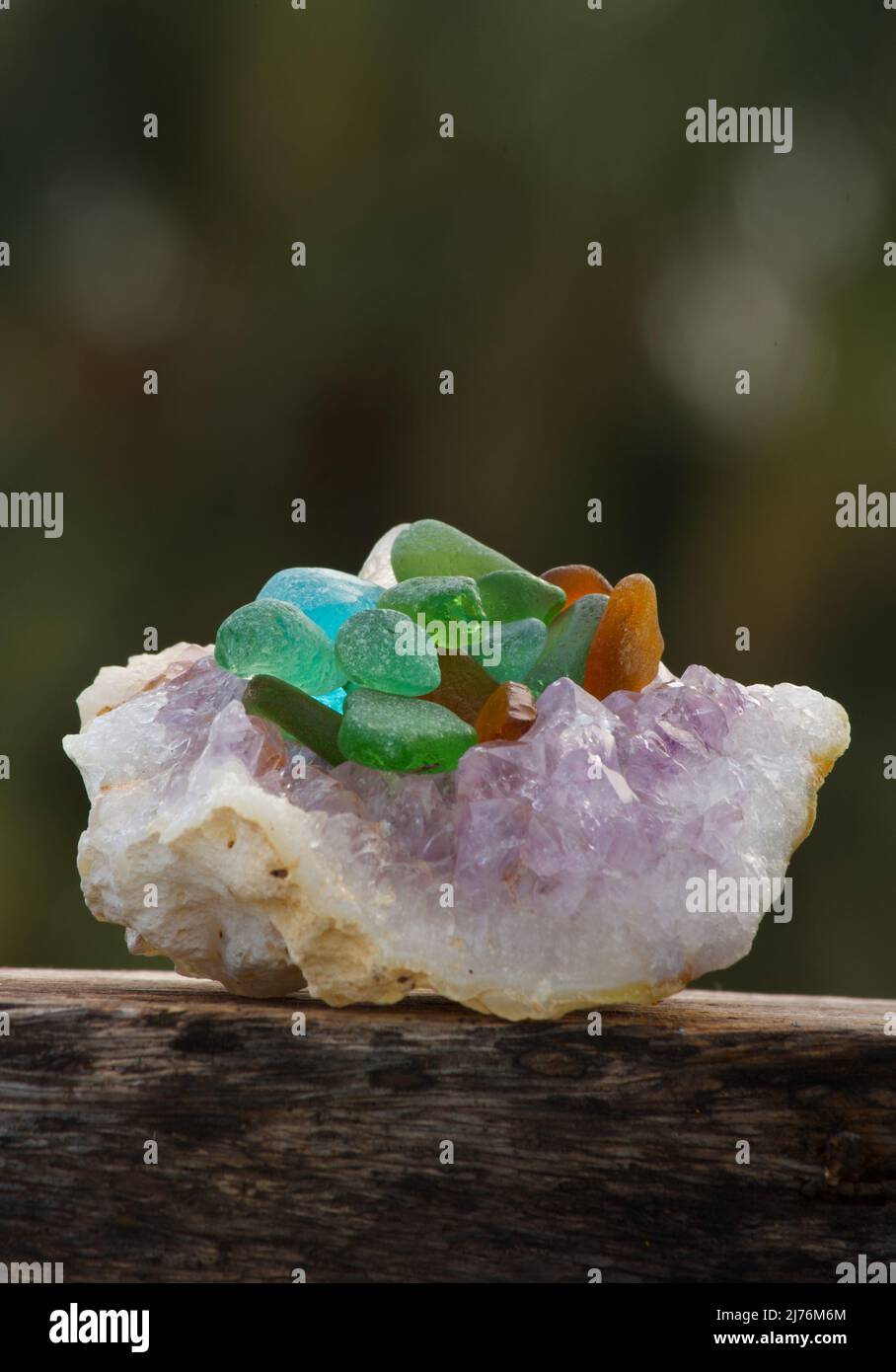 Different types of sea glass pebbles on amethyst shell Stock Photo - Alamy