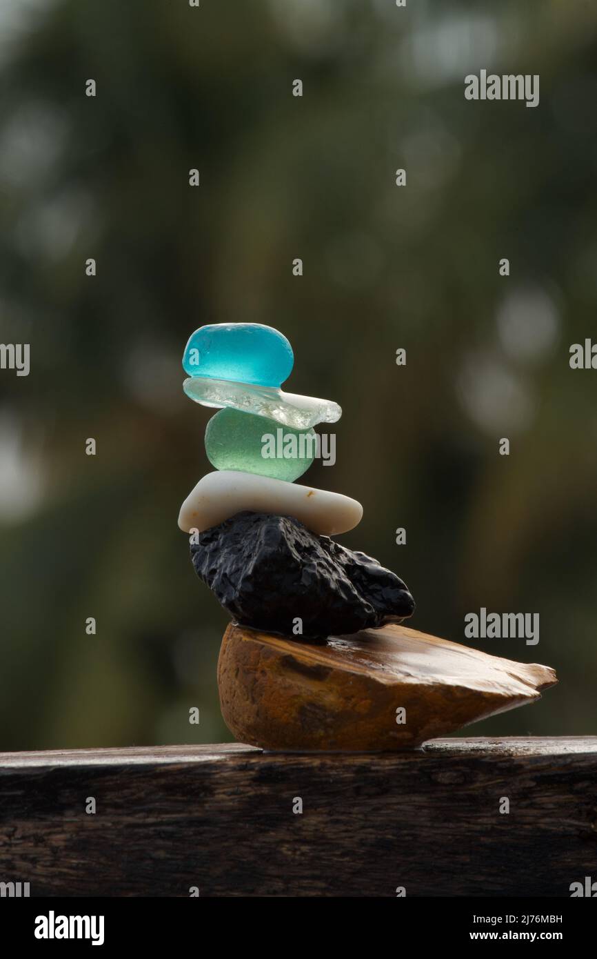 Different types of stone pebbles including sea glass and lava stone ...