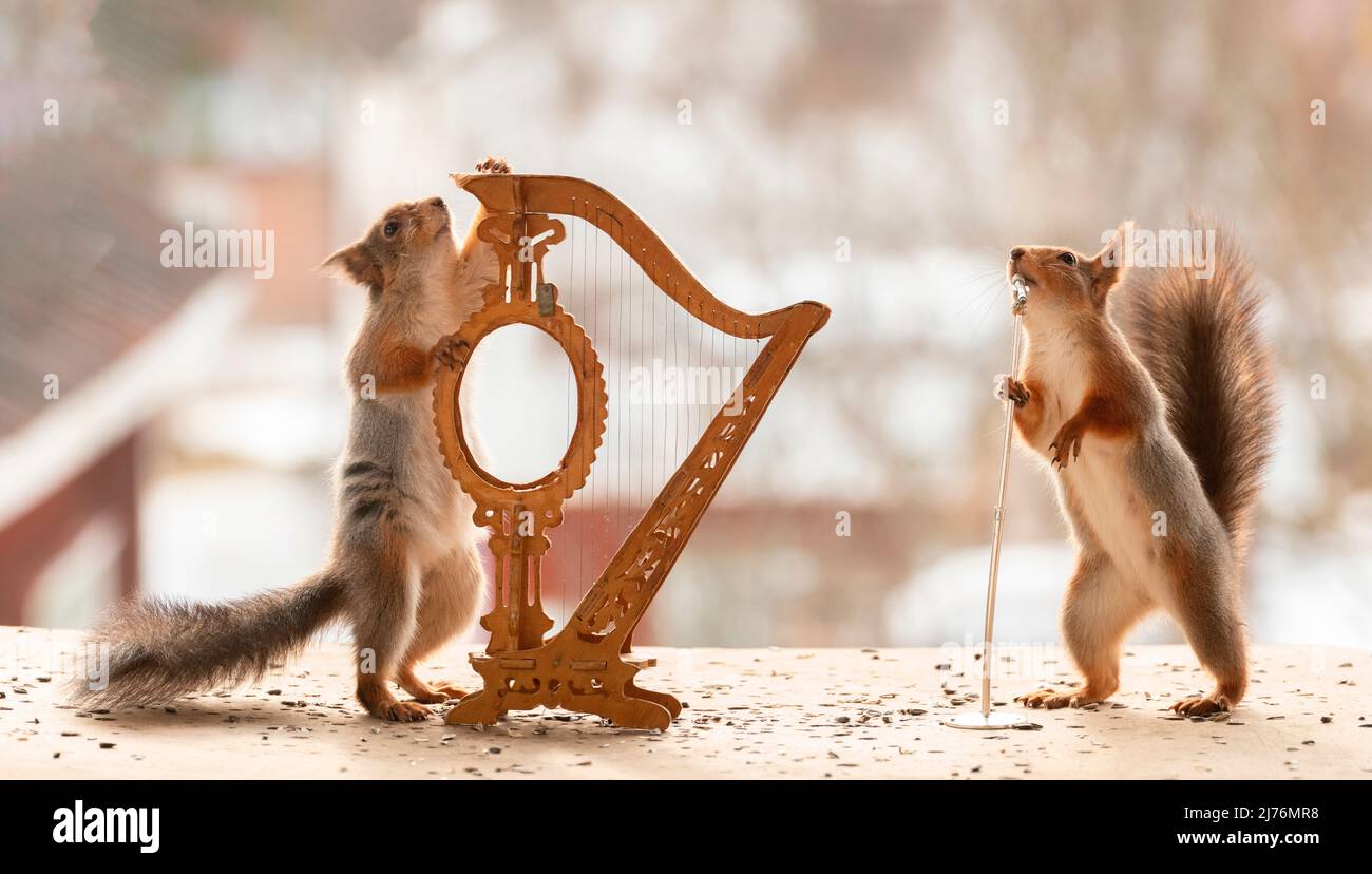Holding harp hi-res stock photography and images - Alamy