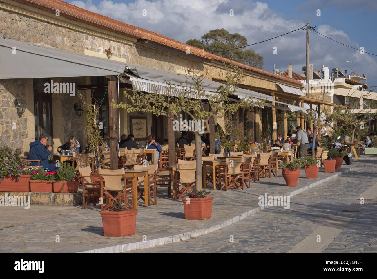 Visitors at bars in Gialova, near Pylos, Peloponnese, Greece,Europe ...
