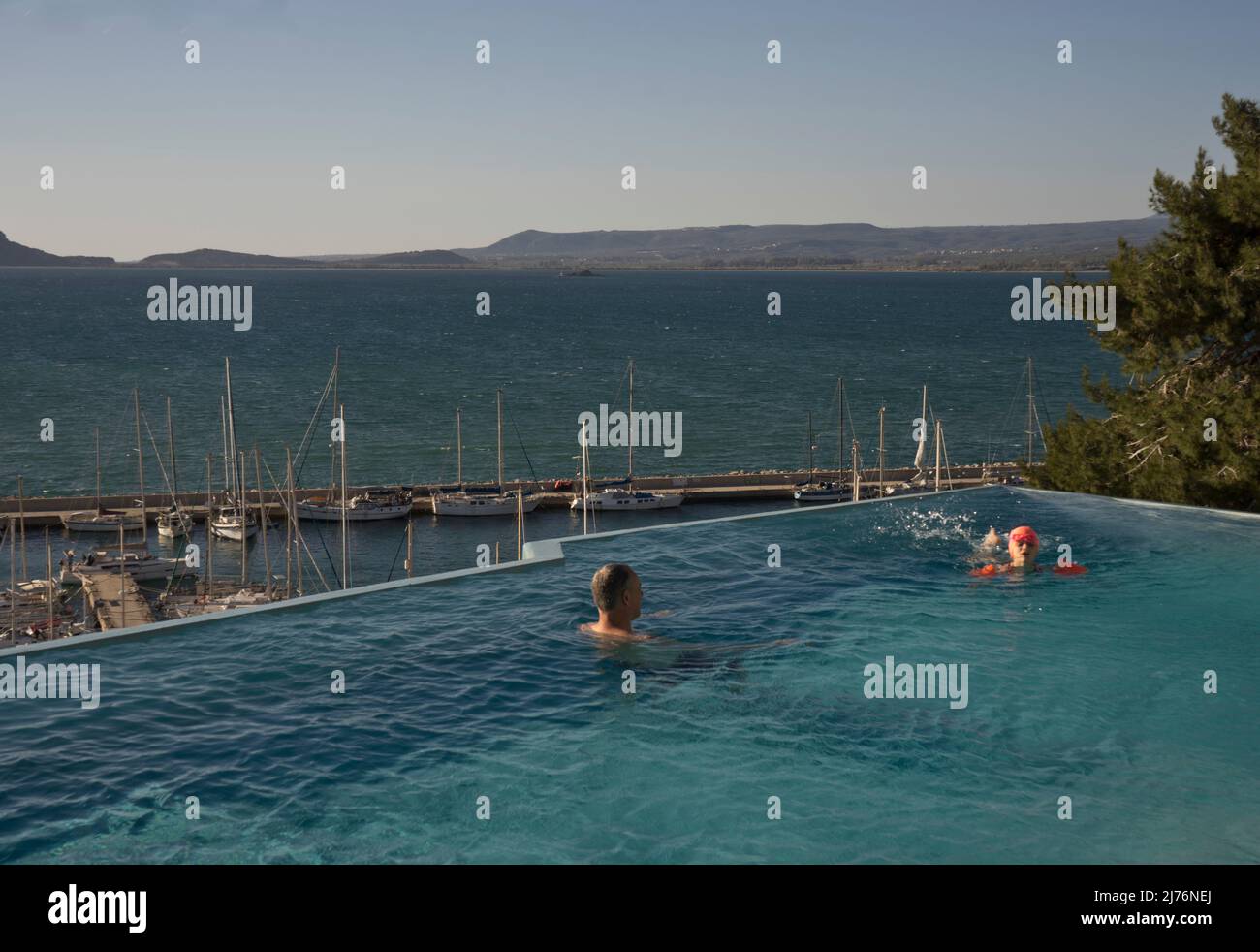 Views of an infinity swimming pool at a hotel by the harbour of Pylos ...