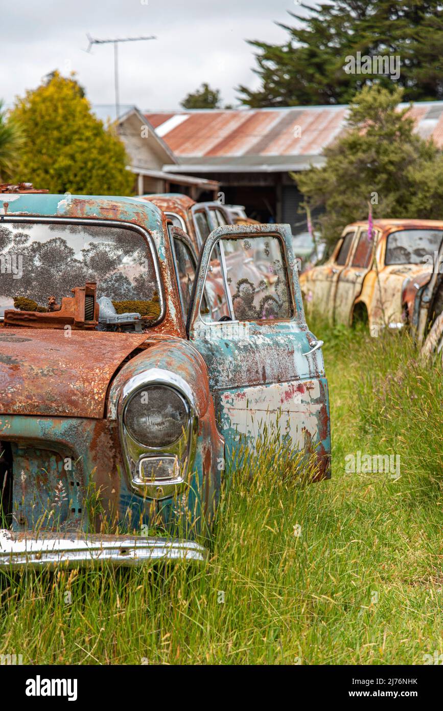 Antique cars on a big scrapyard at the end of Old Coach Road Trail ...