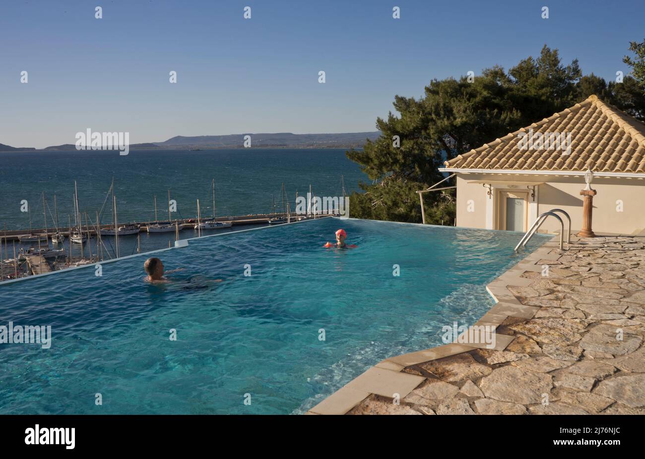 Views of an infinity swimming pool at a hotel by the harbour of Pylos ...