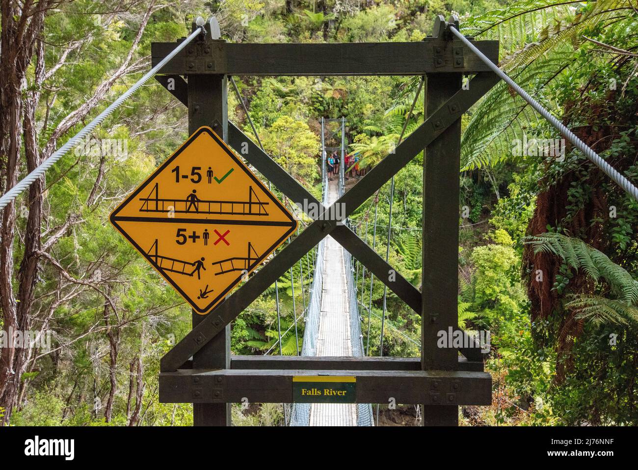 Warning signs about a suspension footbridge in Abel Tasman Cost Track ...