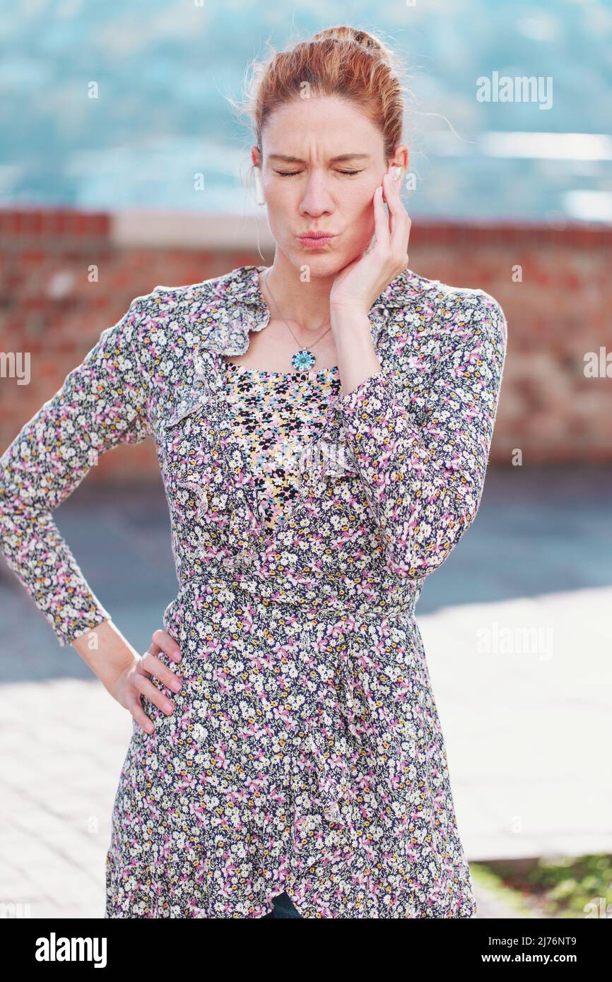 Young woman reacting surprised hi-res stock photography and images - Alamy