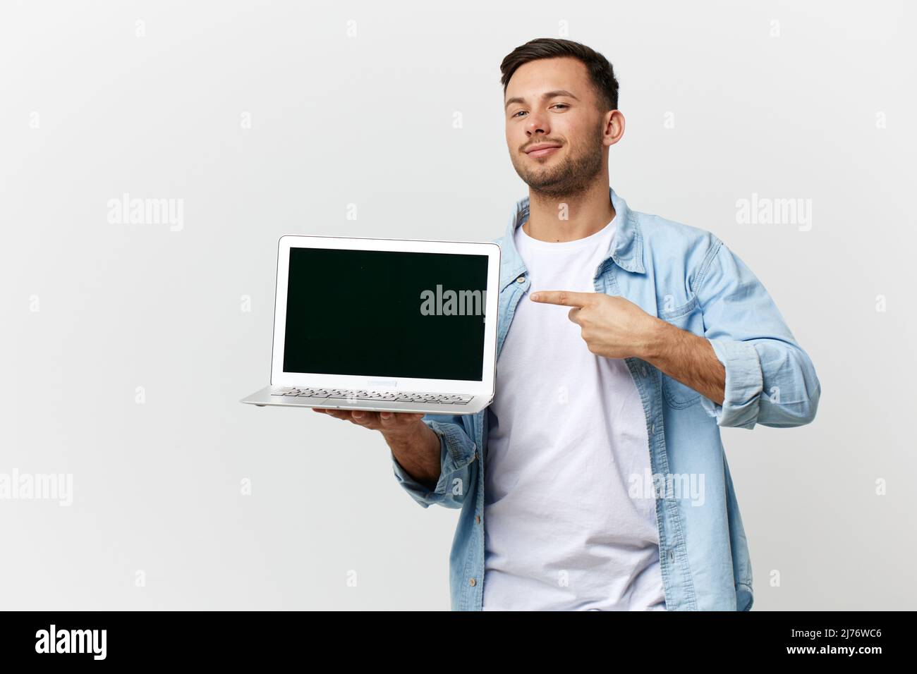 Cheerful friendly tanned handsome IT professional man in casual basic t ...