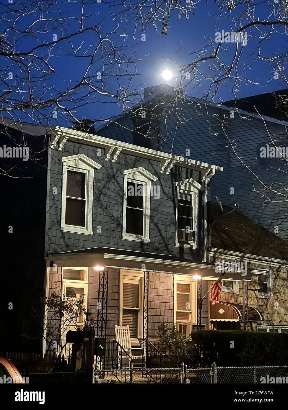 Moon rise over buildings over old frame houses in gthe Kensington ...