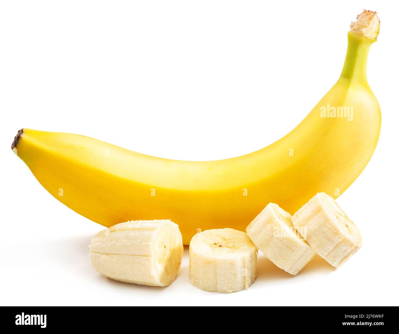 Yellow banana and banana slices. Objects are isolated on white ...