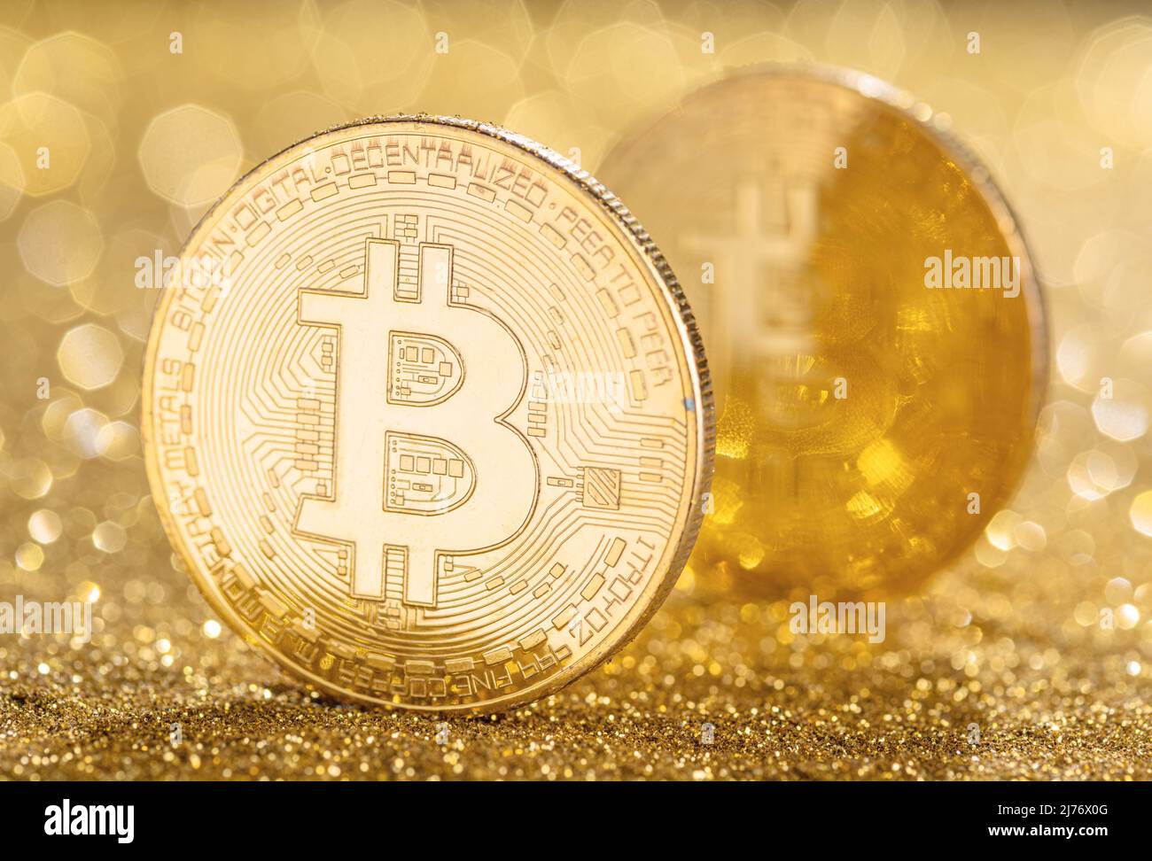 Gold bitcoin coin at the blazing gold background. Conceptual picture of ...