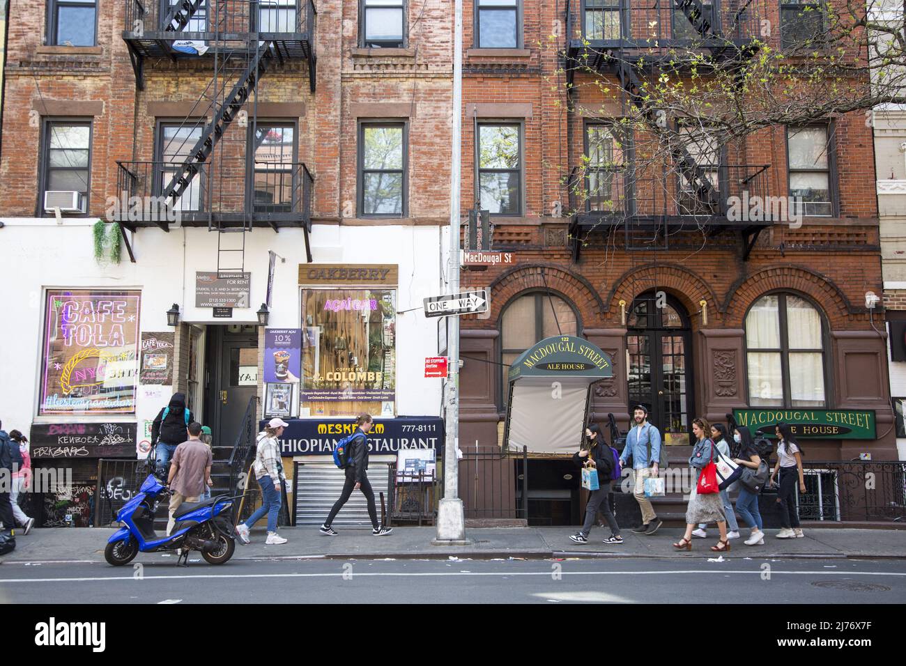 People walking on MacDougal Street in the heart of Greenwich Village ...
