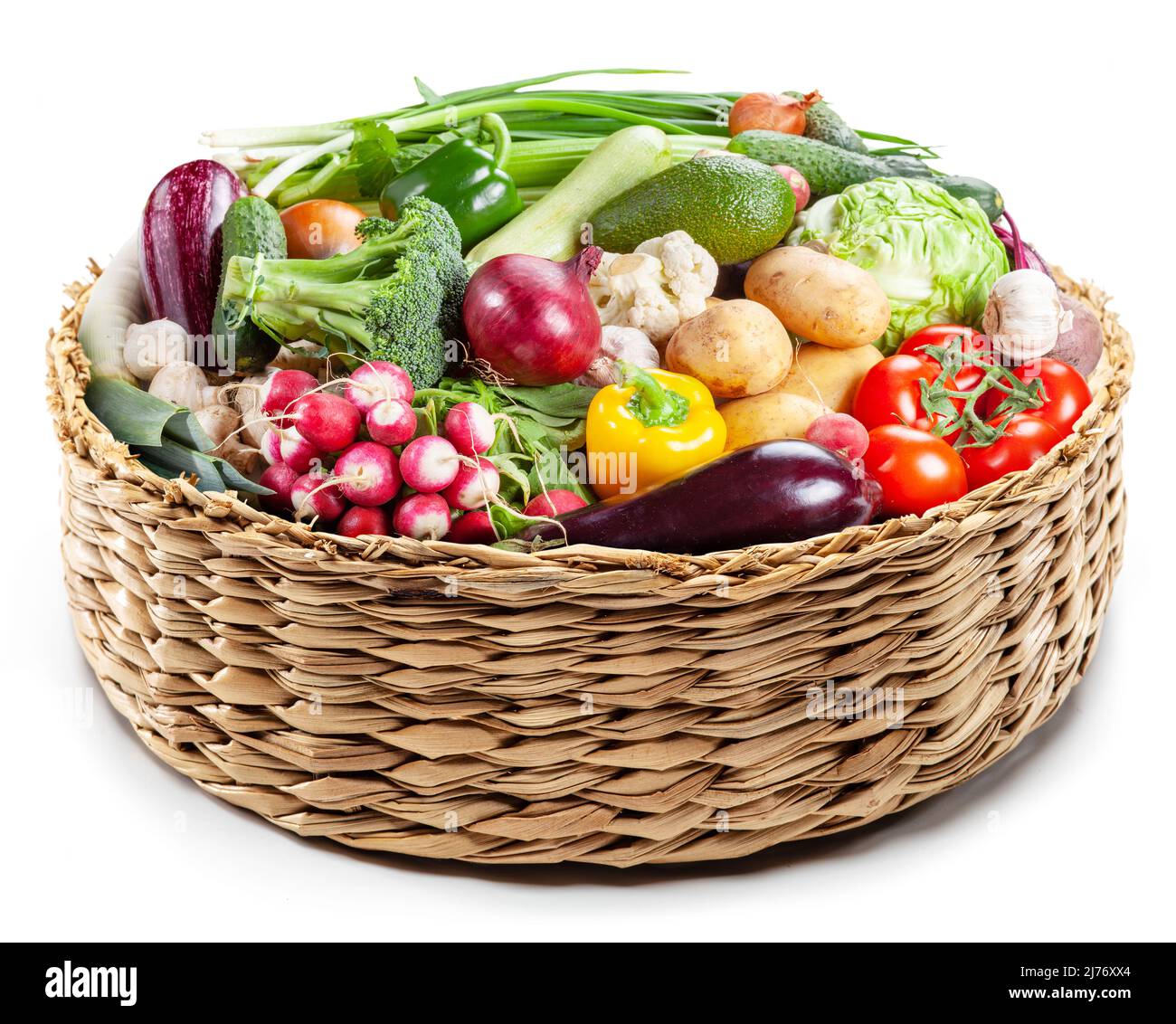Food basket. Vast of different vegetables in the wicker basket on white ...