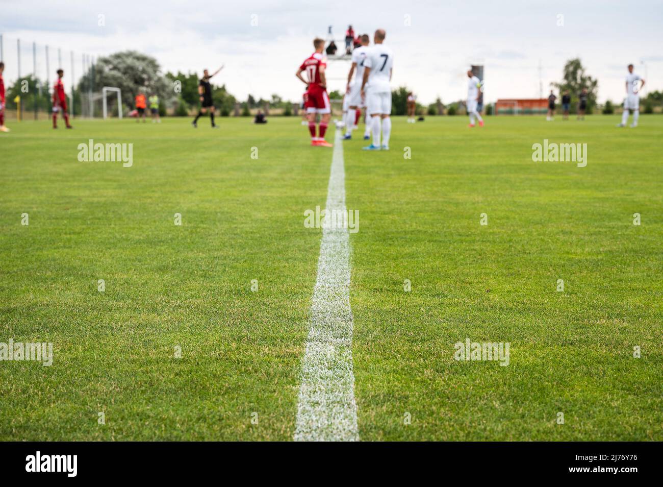 Football center line, footballers during the match in the background ...
