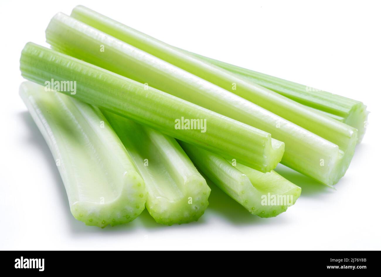 Pile of celery ribs isolated on white background Stock Photo - Alamy