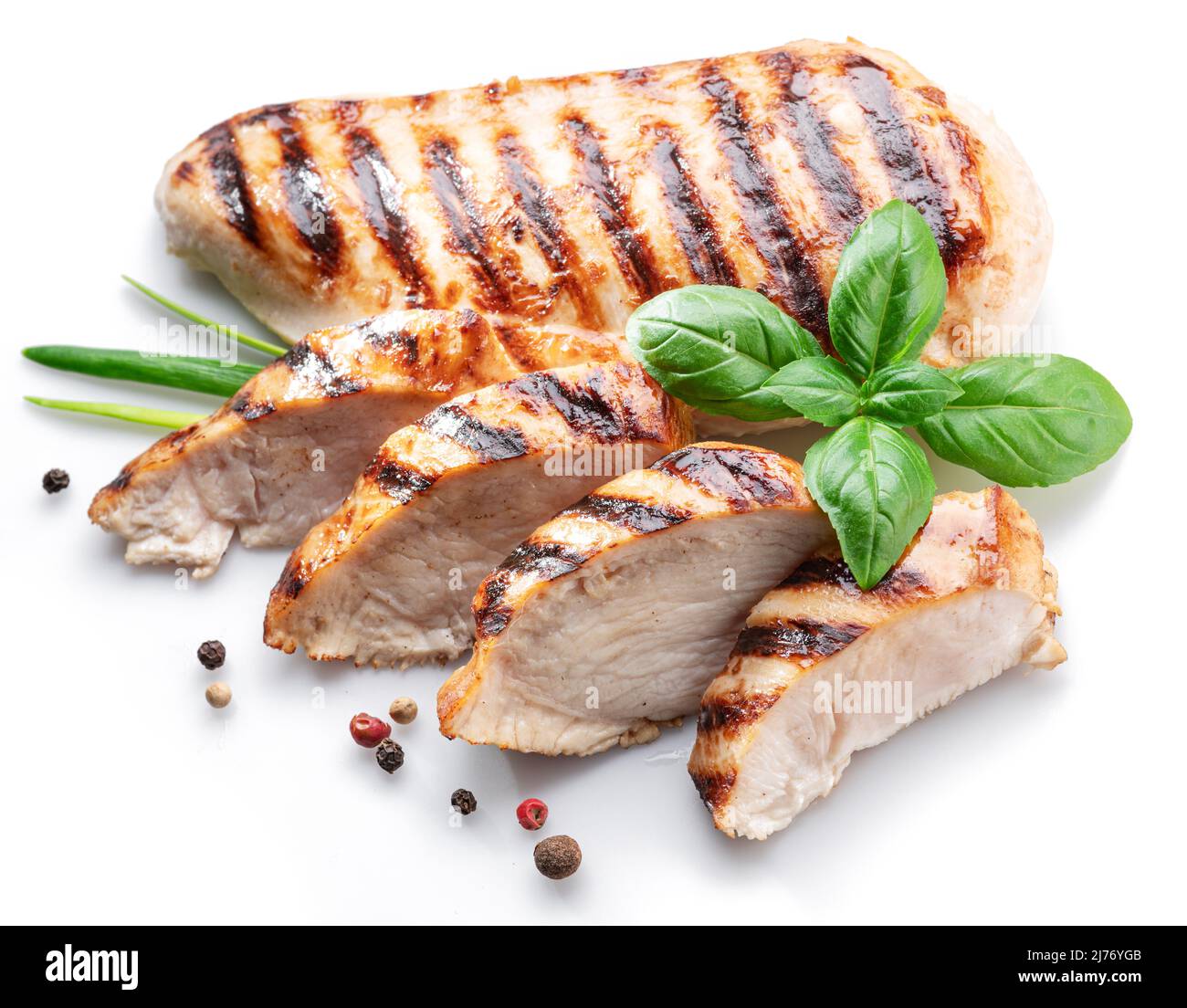 Grilled chicken fillet with herbs isolated on white background Stock ...