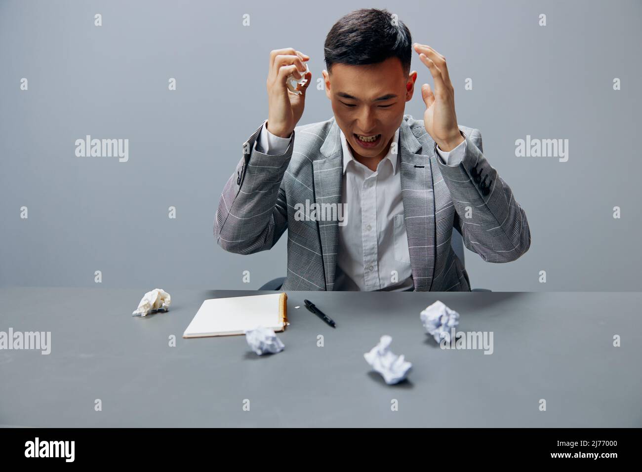 man fatigue nervous breakdown hard work crumpled paper on the table ...