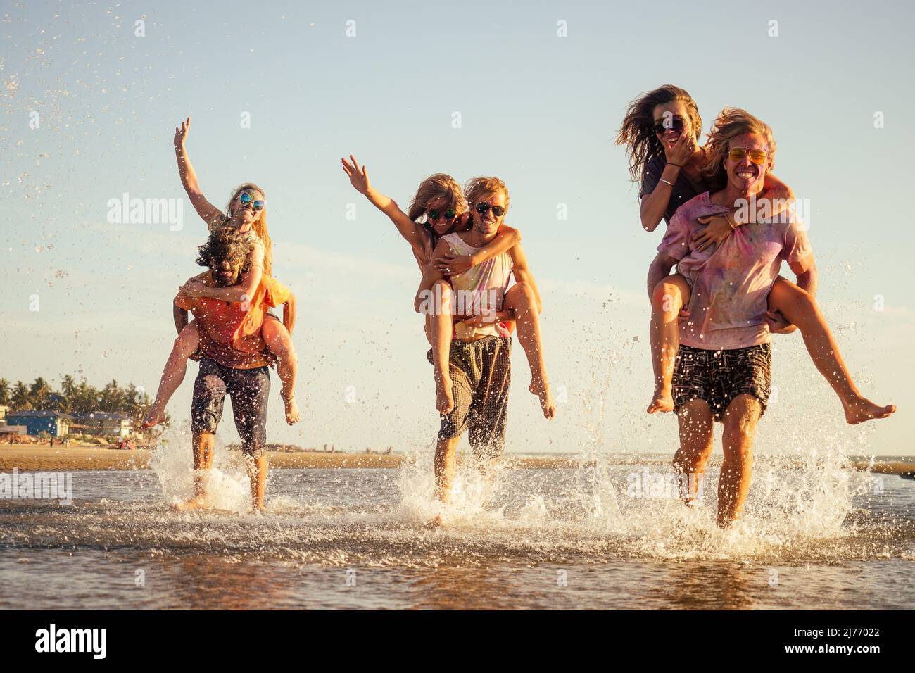 Piggyback friends beach hi-res stock photography and images - Alamy