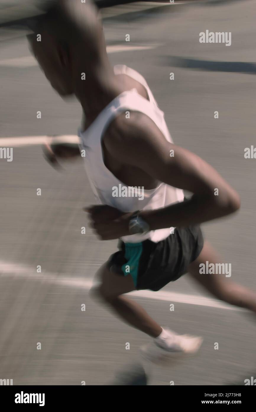 Generic long distance runner/ athlete in close up. Blurred motion Stock ...