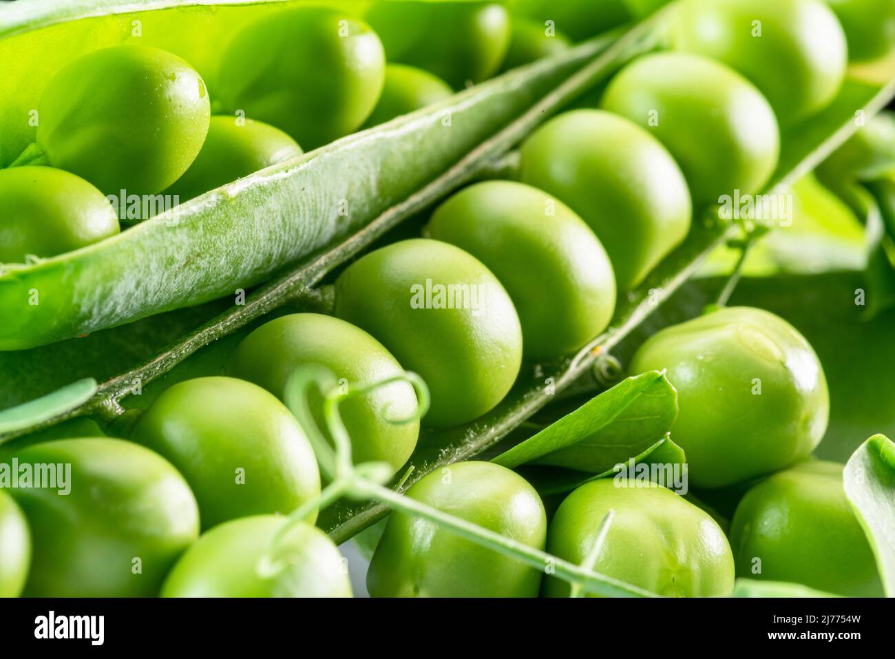 Perfect green peas in pea pods close up. Food background Stock Photo ...
