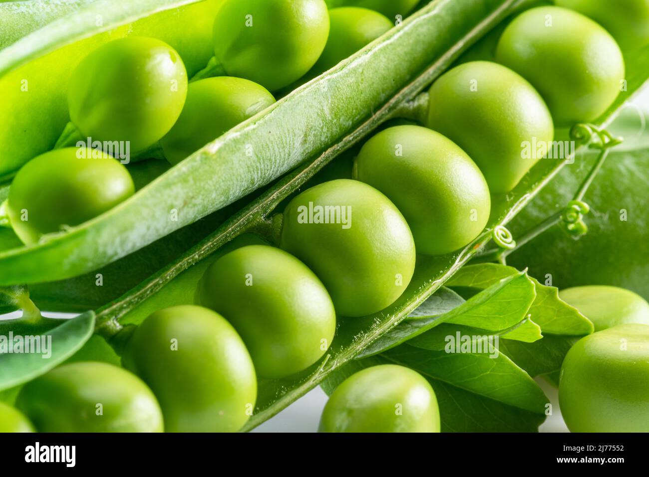 Perfect green peas in pea pods close up. Food background Stock Photo ...
