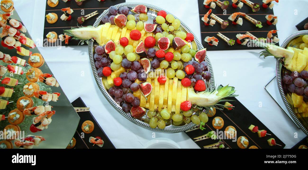 Different fruits and light appetizers provided during catered events ...