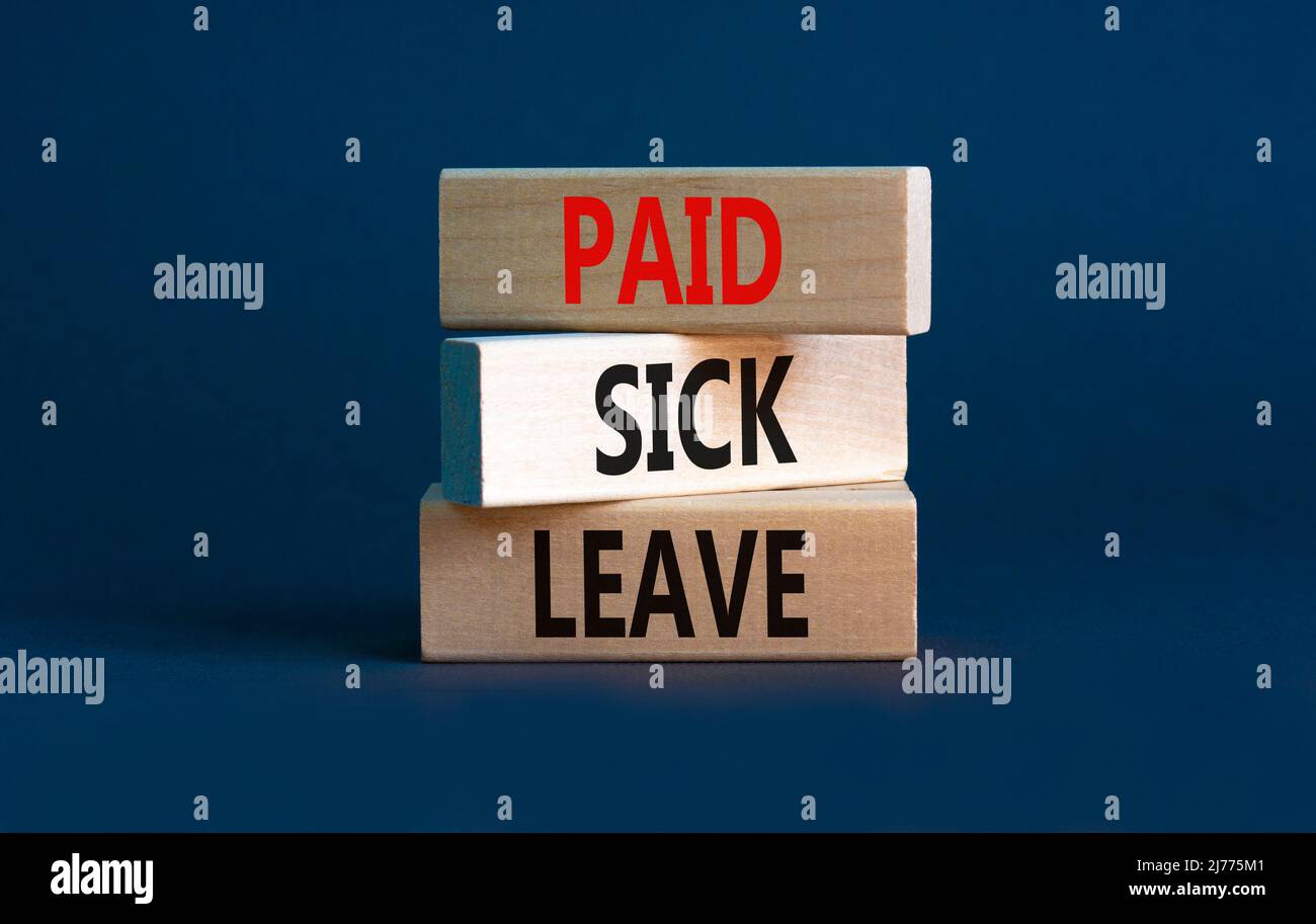 Paid sick leave symbol. Concept words Paid sick leave on wooden blocks ...