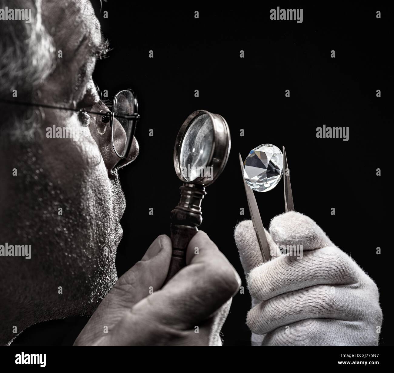 Large gemstone in jeweler's hand close up. Gem identifying and ...