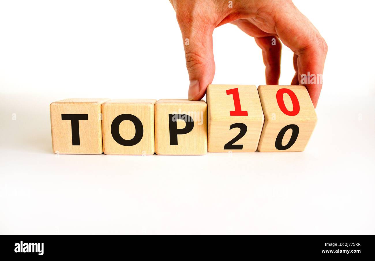 From Top 20 to 10 symbol. Businessman turns wooden cubes and changes ...
