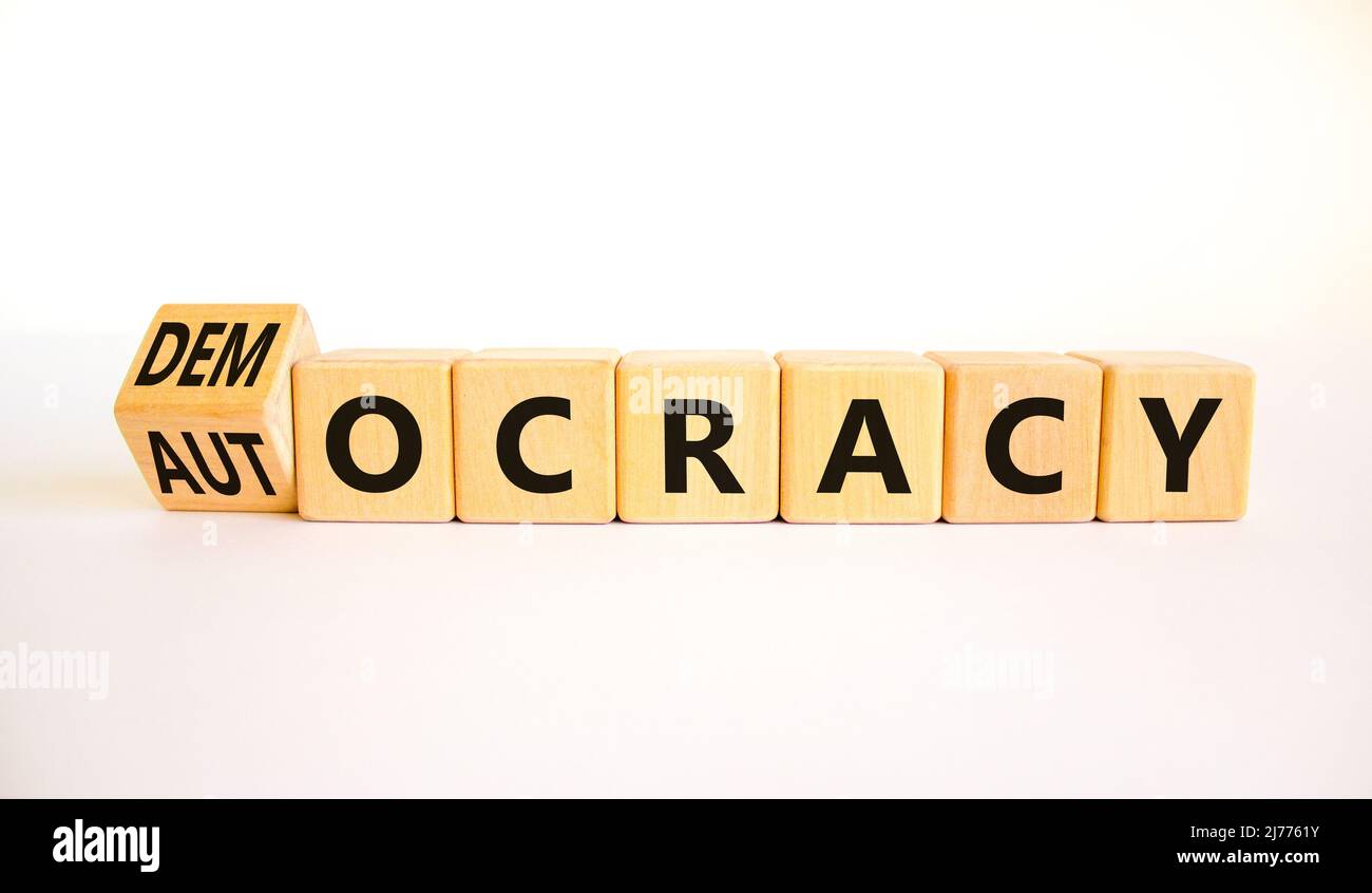 Democracy or autocracy symbol. Turned wooden cubes and changed the ...