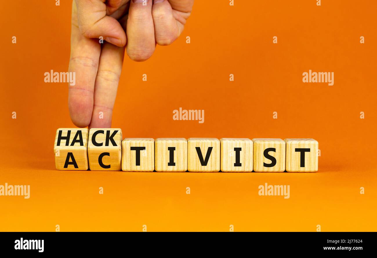 Activist or hacktivist symbol. Businessman turns wooden cubes and ...