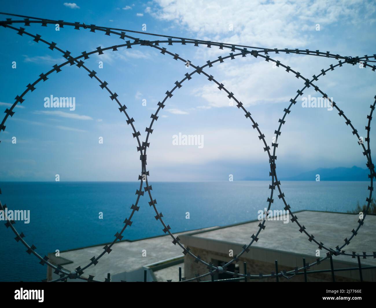Fight for freedom symbol. Loops of spiked or razor wire curling around ...