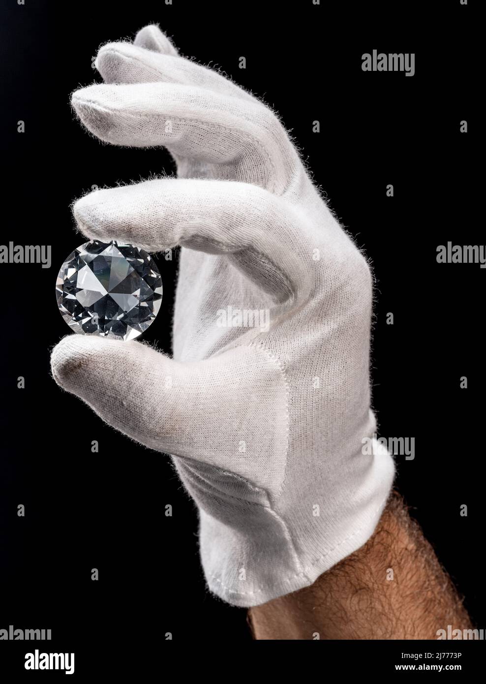 Large gemstone in jeweler's hand close up. Gem identifying and ...