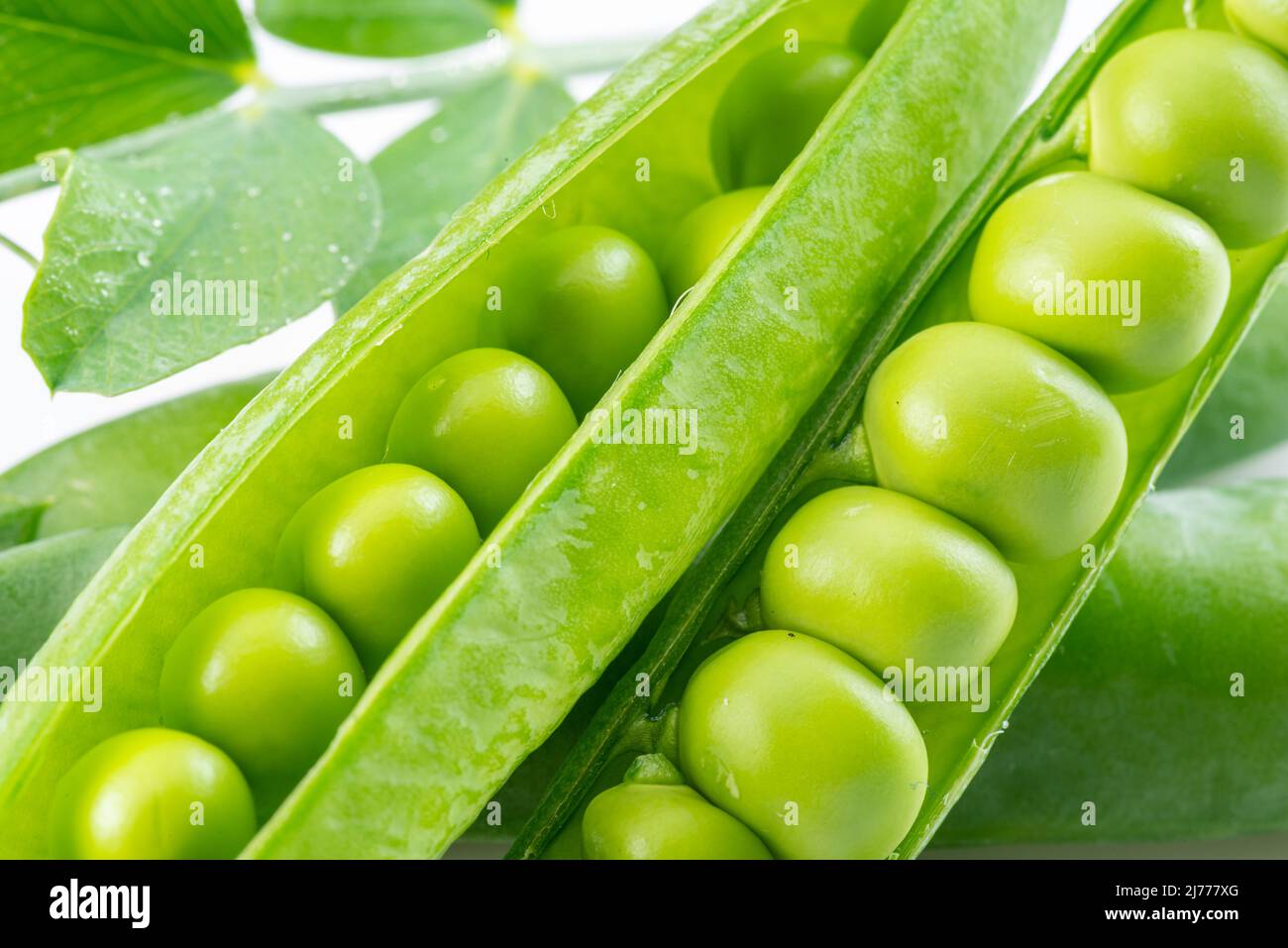 Perfect green peas in pea pods close up. Food background Stock Photo ...