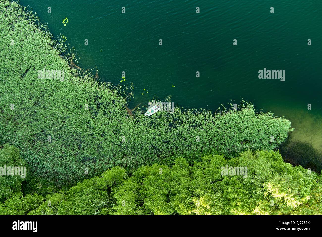 Beautiful top down aerial view of a lake in Moletai region, famous or ...