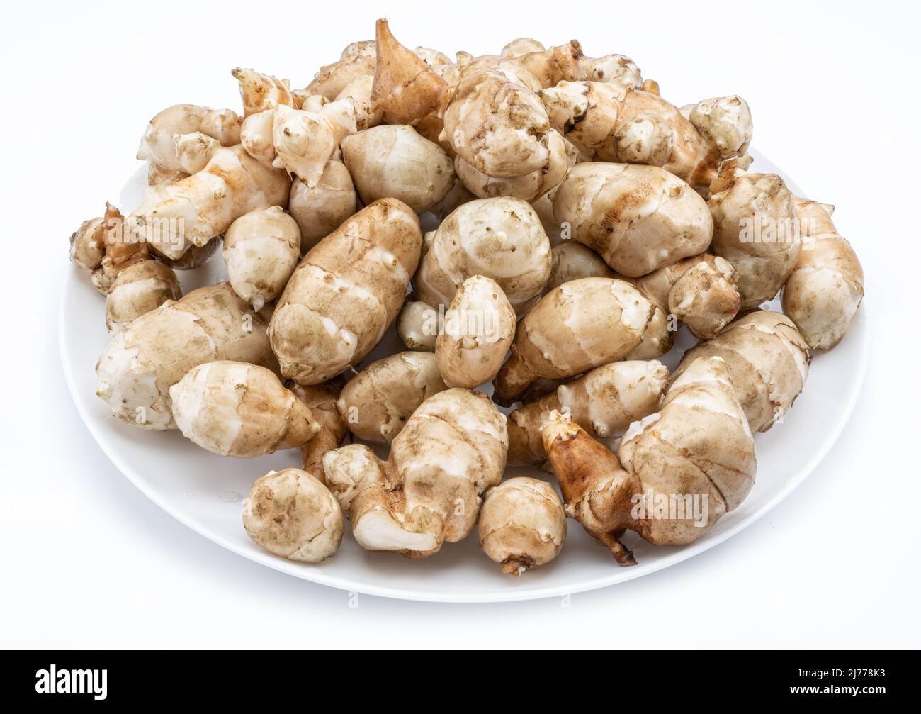 Jerusalem artichoke roots isolated on white background Stock Photo - Alamy