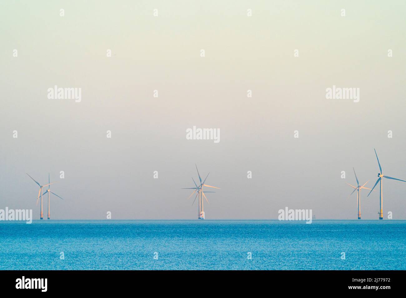 Wind turbines in the dawn light on the horizon at the Kentish Flats ...