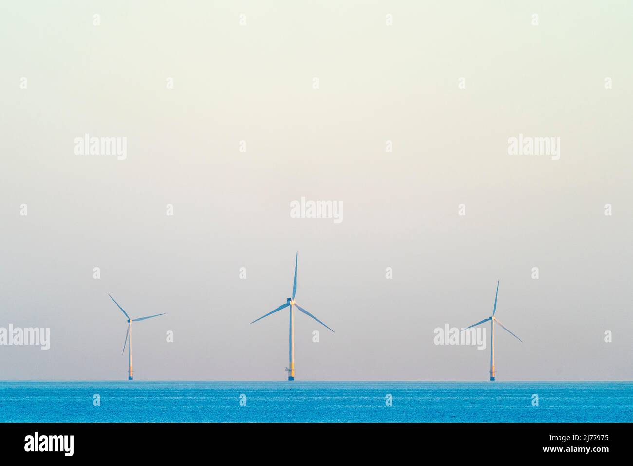 Wind turbines in the dawn light on the horizon at the Kentish Flats ...