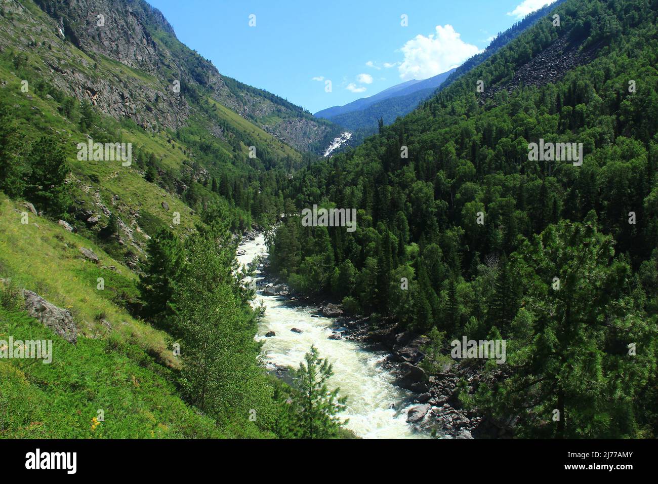 Alpine river from the Uchar waterfall in the Akkurum tract in Altai in ...