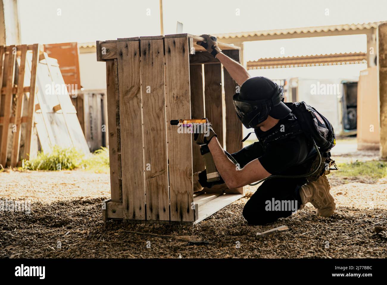 Soldier aiming airsoft gun during tactical game Stock Photo - Alamy