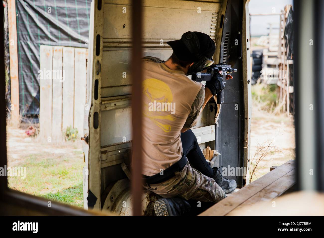 Soldier aiming airsoft gun during tactical game Stock Photo - Alamy