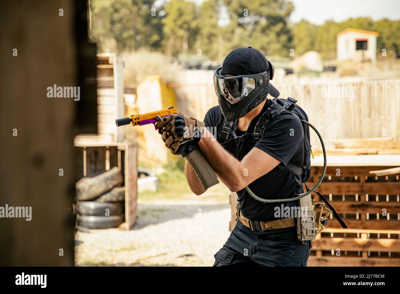 Soldier aiming airsoft gun during tactical game Stock Photo - Alamy
