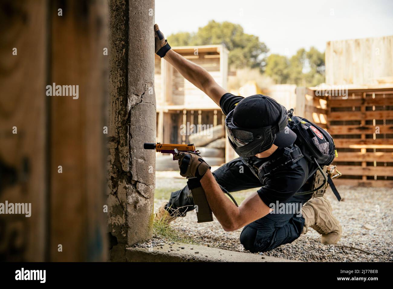 Soldier aiming airsoft gun during tactical game Stock Photo - Alamy