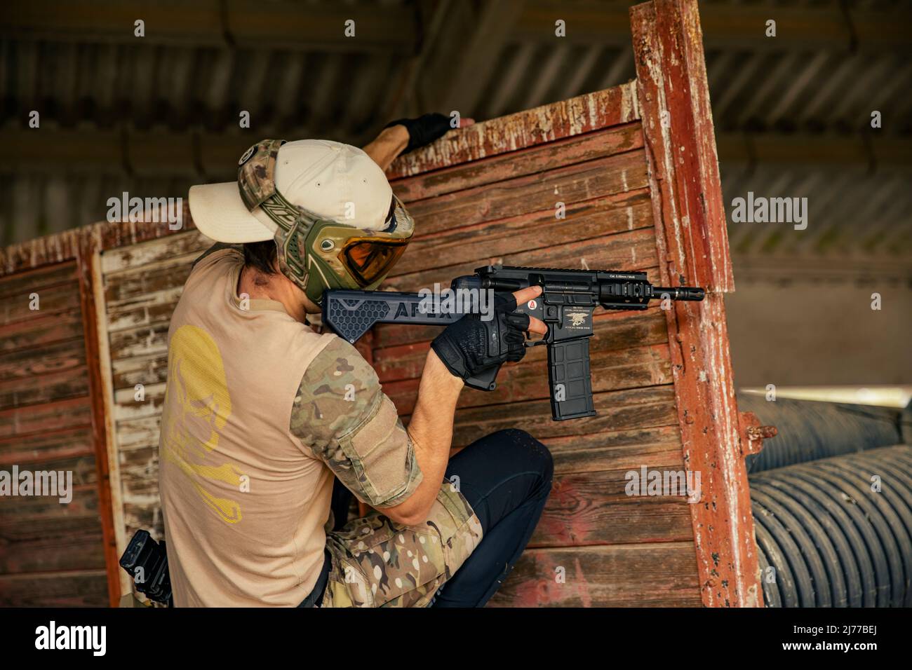 Soldier aiming airsoft gun during tactical game Stock Photo - Alamy