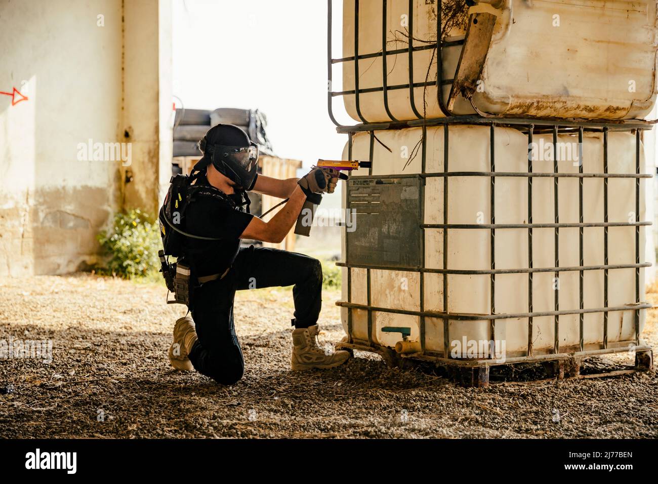 Soldier aiming airsoft gun during tactical game Stock Photo - Alamy