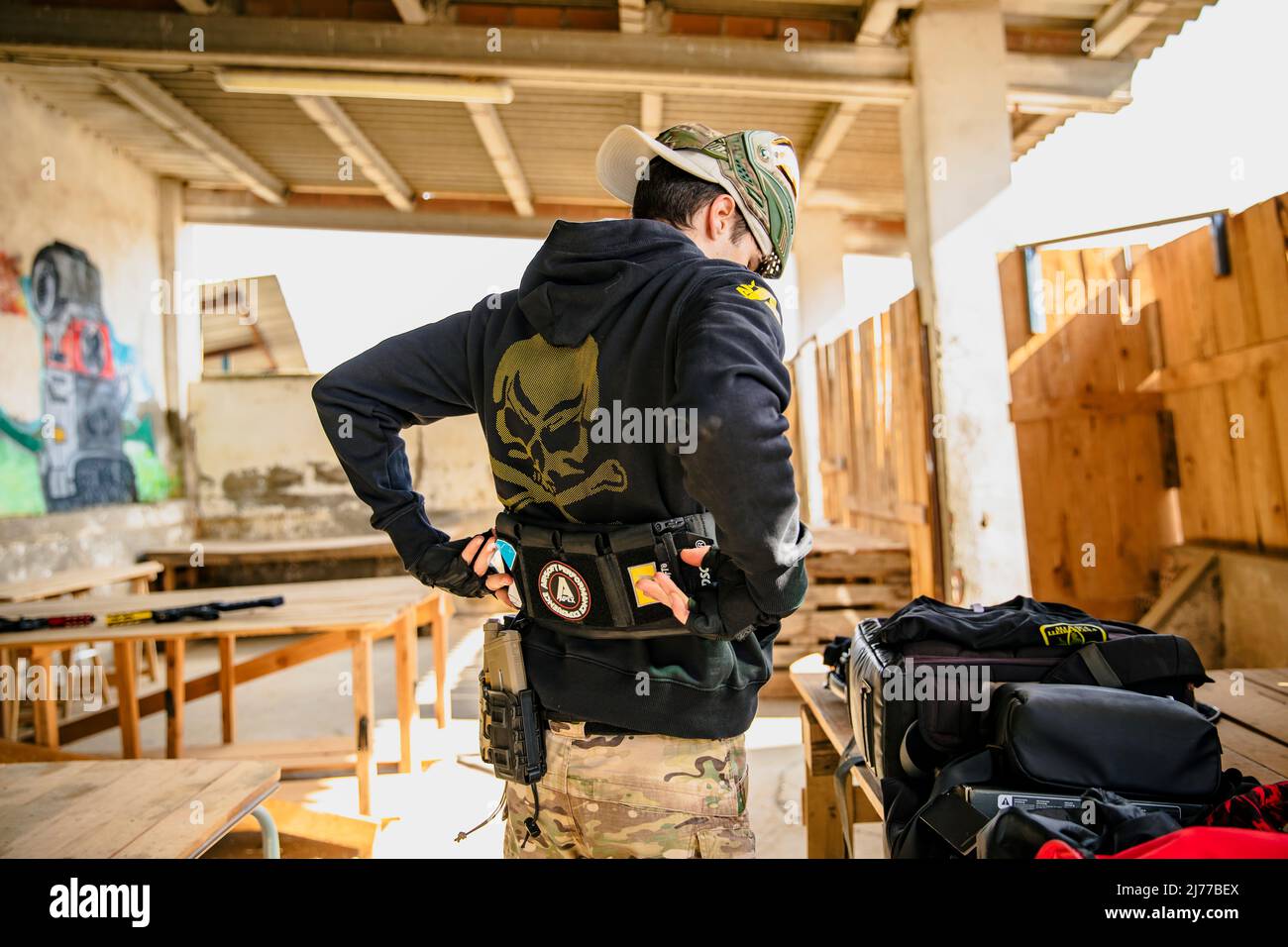 Airsoft soldier preparing for battle at training ground Stock Photo - Alamy